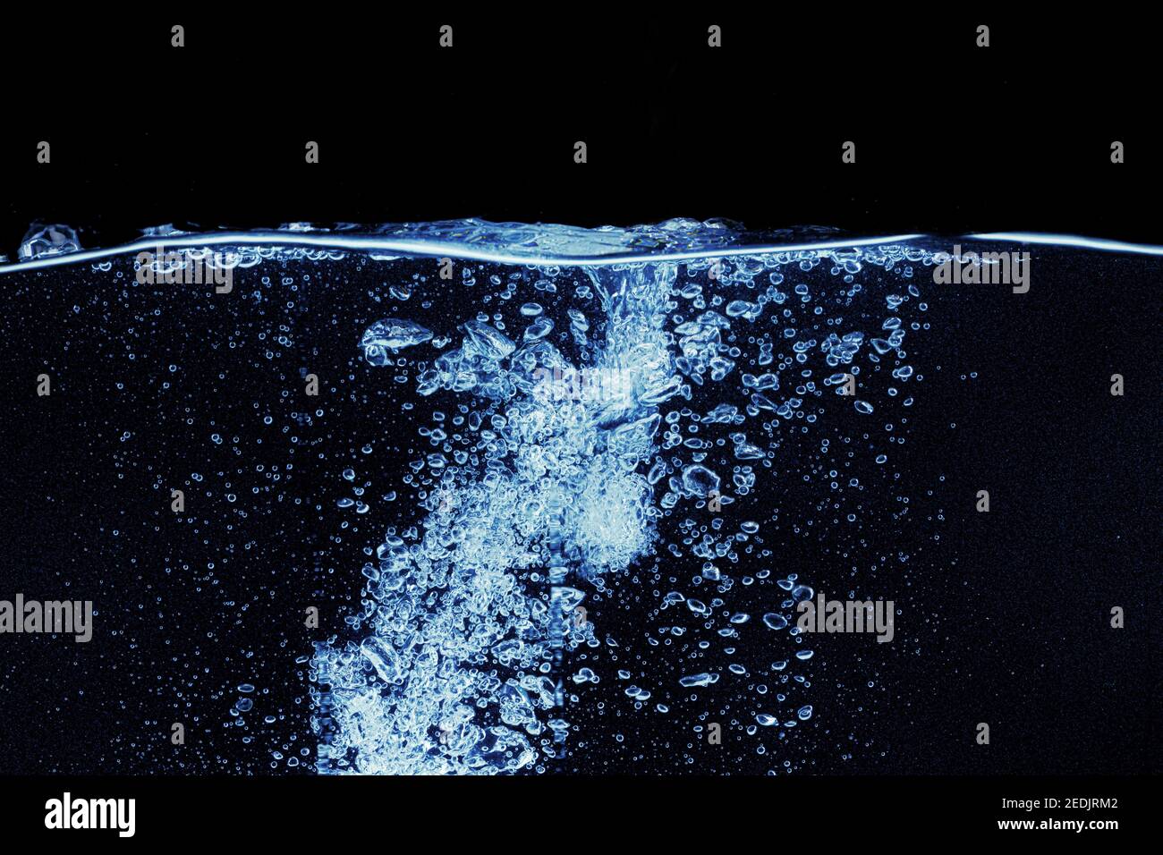 Water splash in aquarium isolated on black background Stock Photo - Alamy