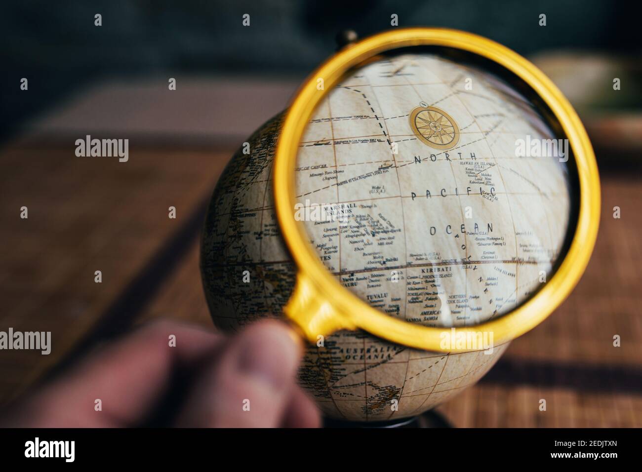 Globe map search for travel directions - view through magnifying glass ...