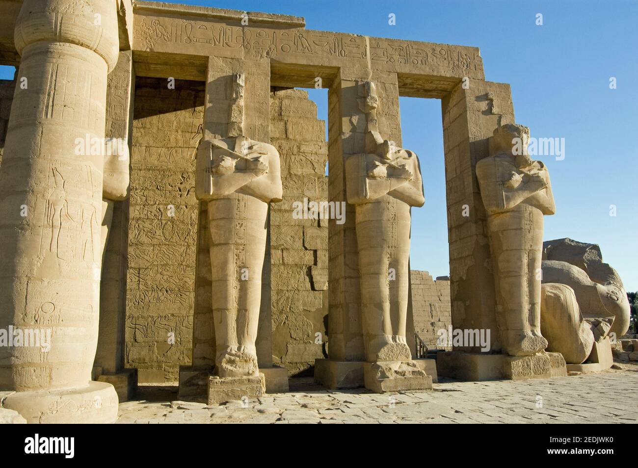 Huge statues of the Pharaoh Ramses II in an inner courtyard of the ...