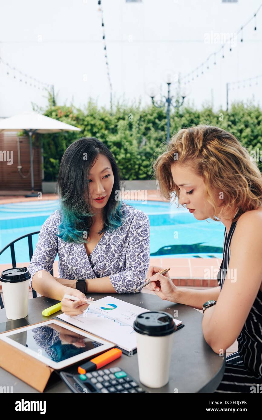 Professional women discussing outdoors hi-res stock photography and ...