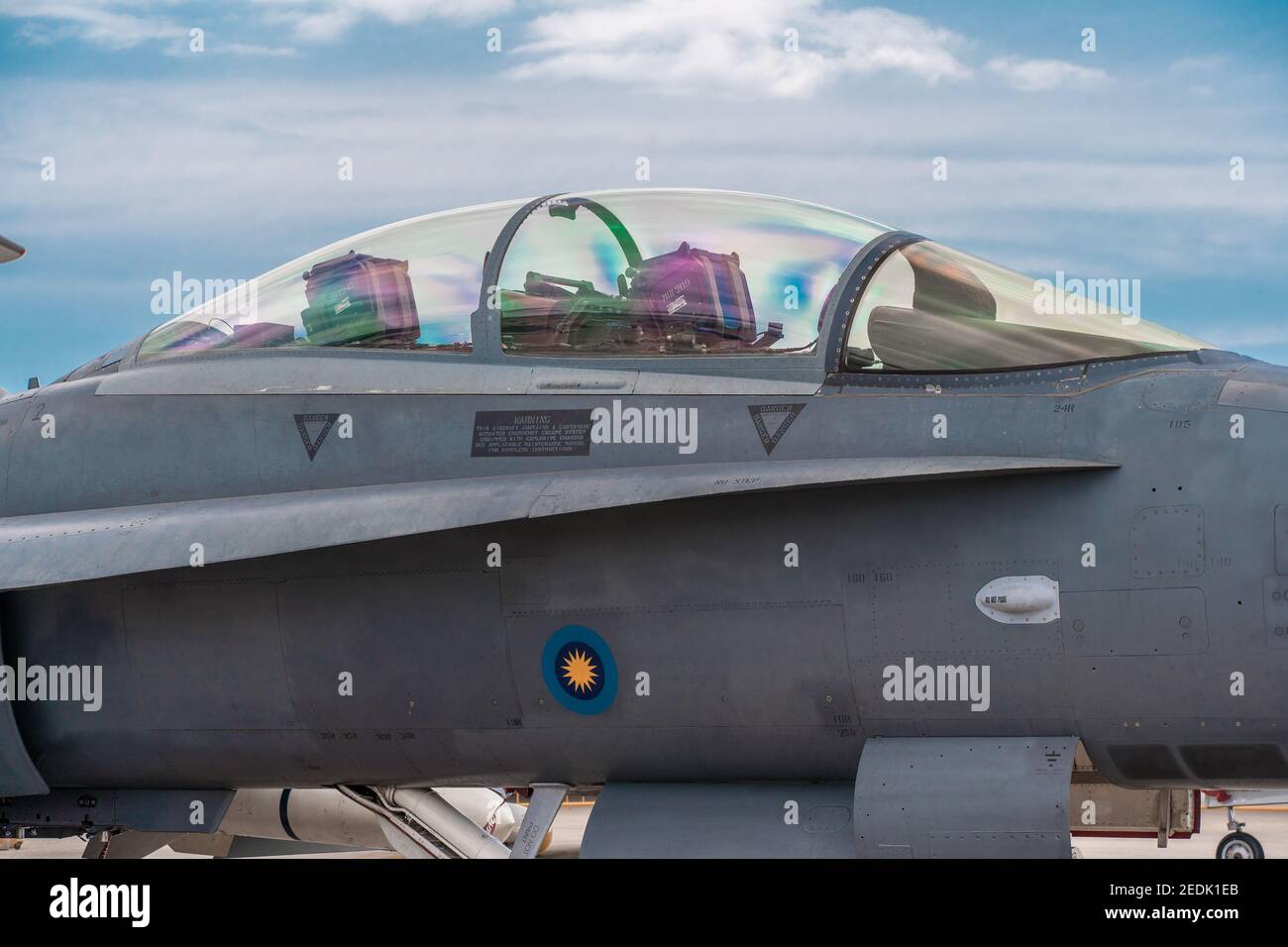 Cockpit of a powerful gray-colored military fighter jet under the ...