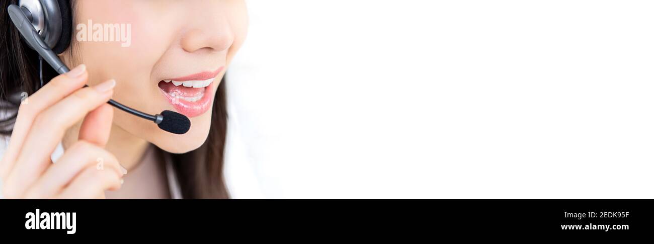 Young woman wearing microphone headset working in call center as a ...