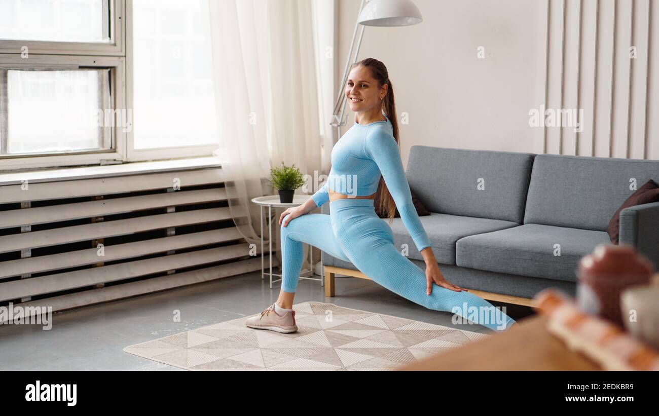 Fit woman doing front forward one leg step lunge exercises workout at ...