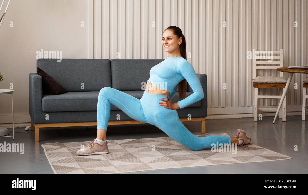 Fit woman doing front forward one leg step lunge exercises workout at ...