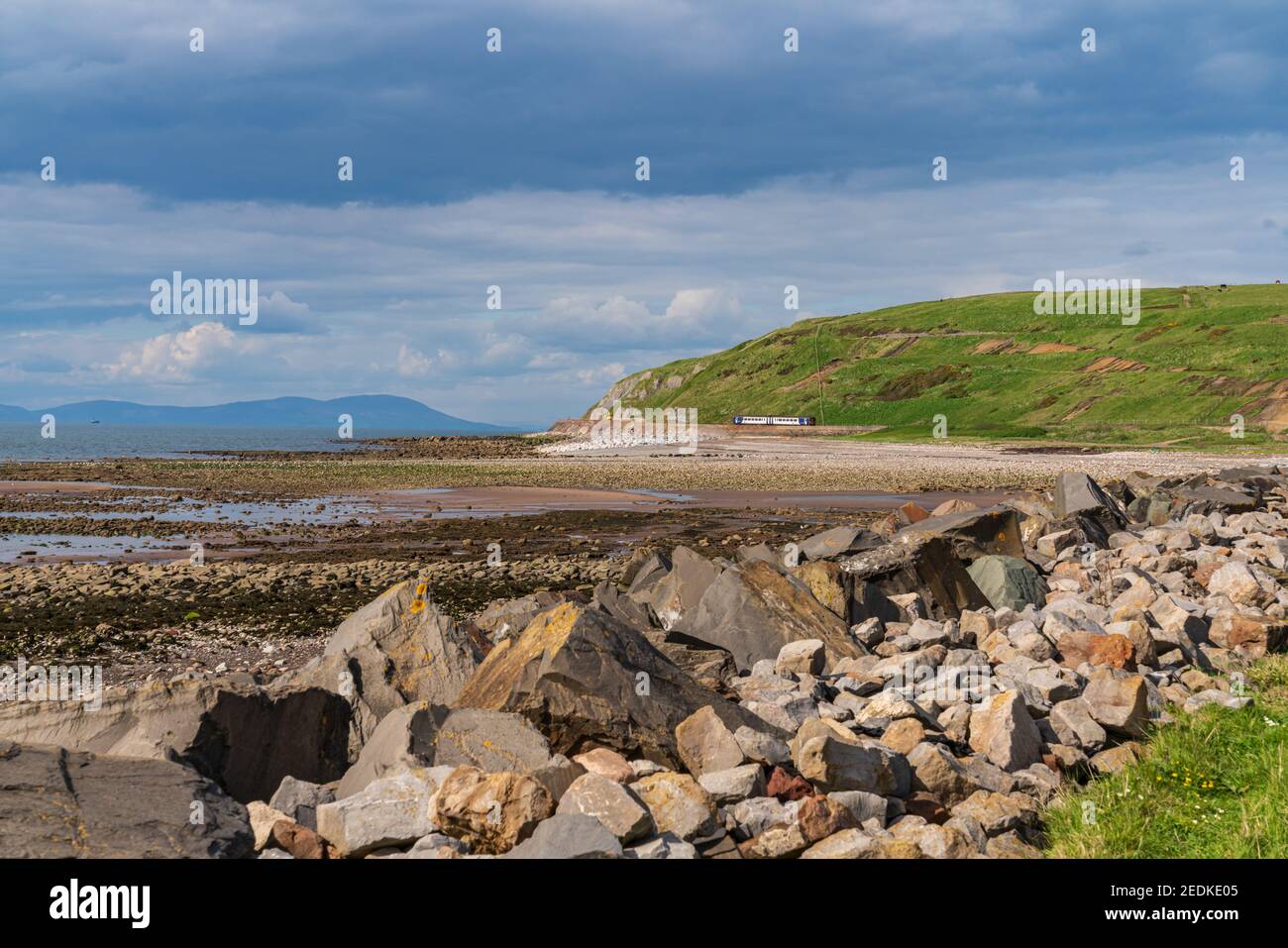 Parton, Cumbria, England, UK - May 03, 2019: A train passing Parton Bay ...