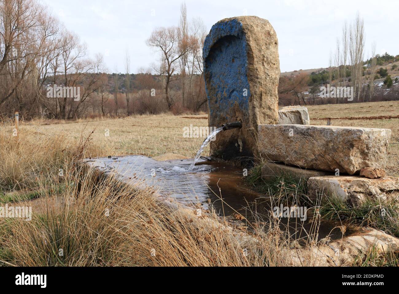 Pure and clean mountain waters. Ancient and natural fountain Stock ...