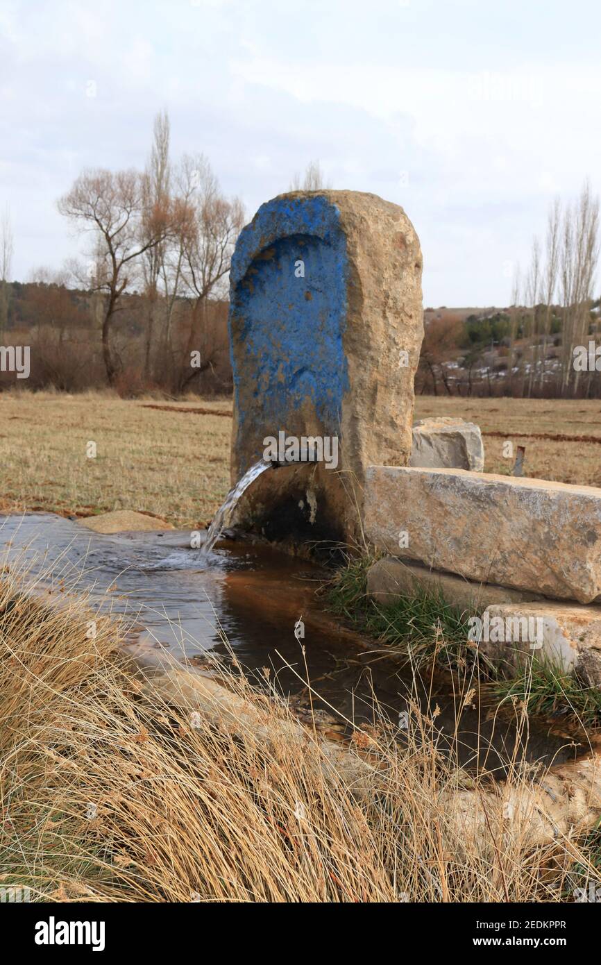 Pure and clean mountain waters. Ancient and natural fountain Stock ...