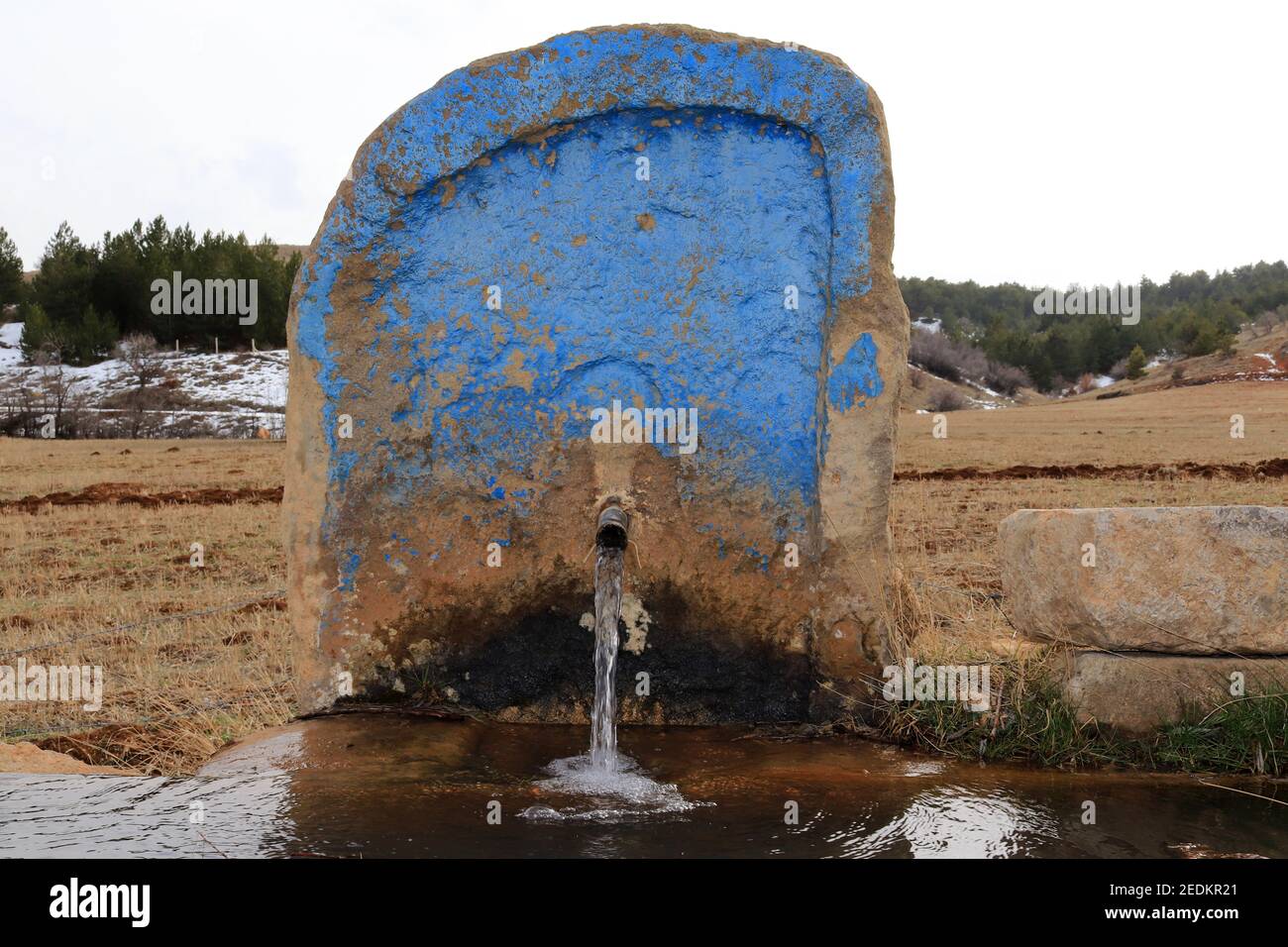 Pure and clean mountain waters. Ancient and natural fountain Stock ...
