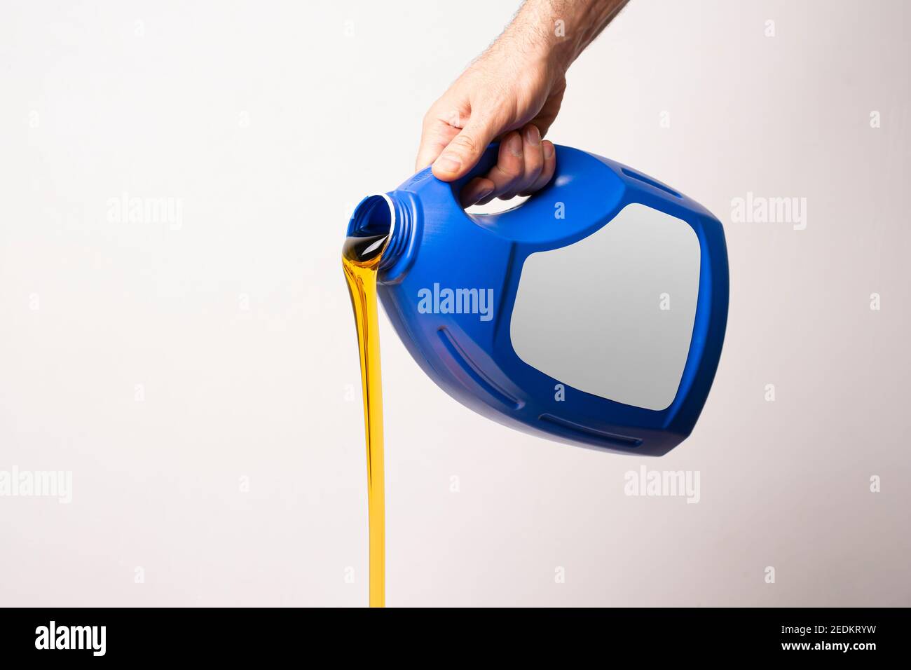 Pouring detergent liquid in front of light gray background, editable ...
