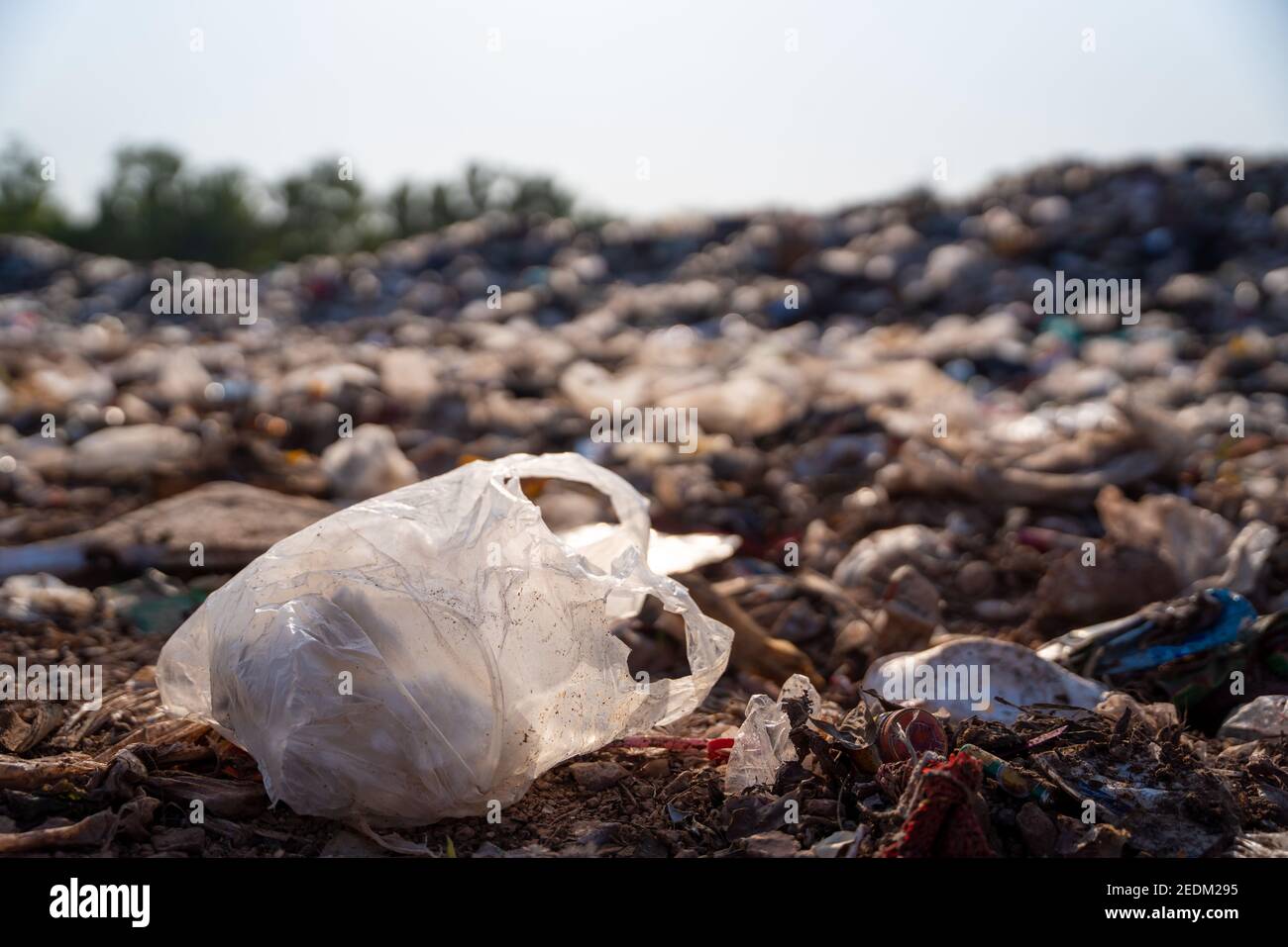 Non-compostable plastics at the waste disposal site, global warming ...