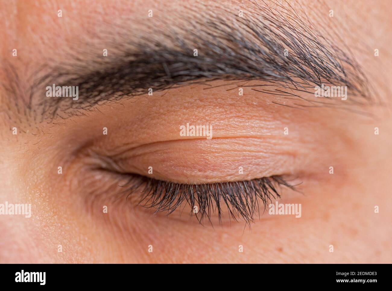 Closed left eye Stock Photo - Alamy