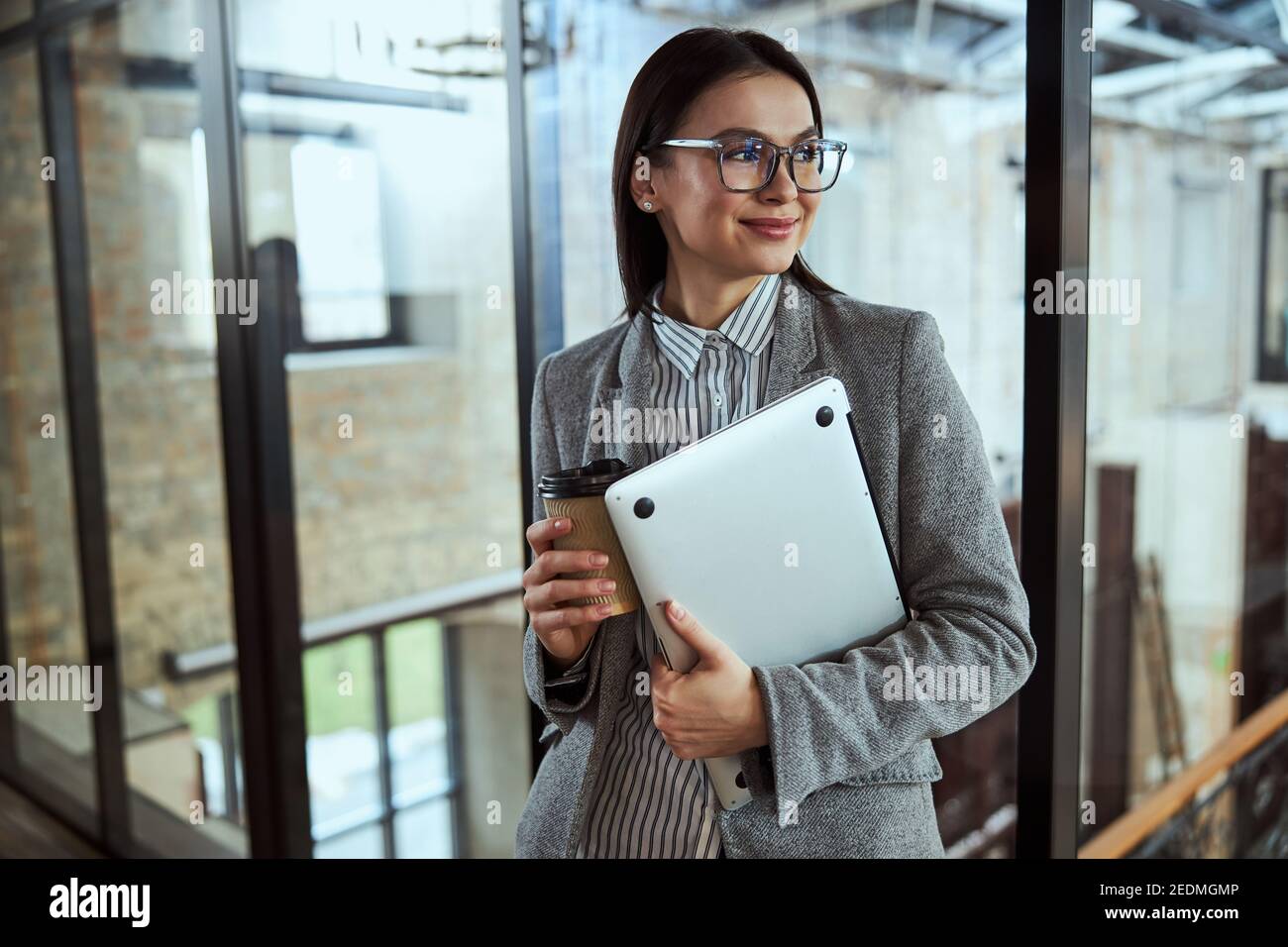 Woman keeping laptop in hi-res stock photography and images - Alamy