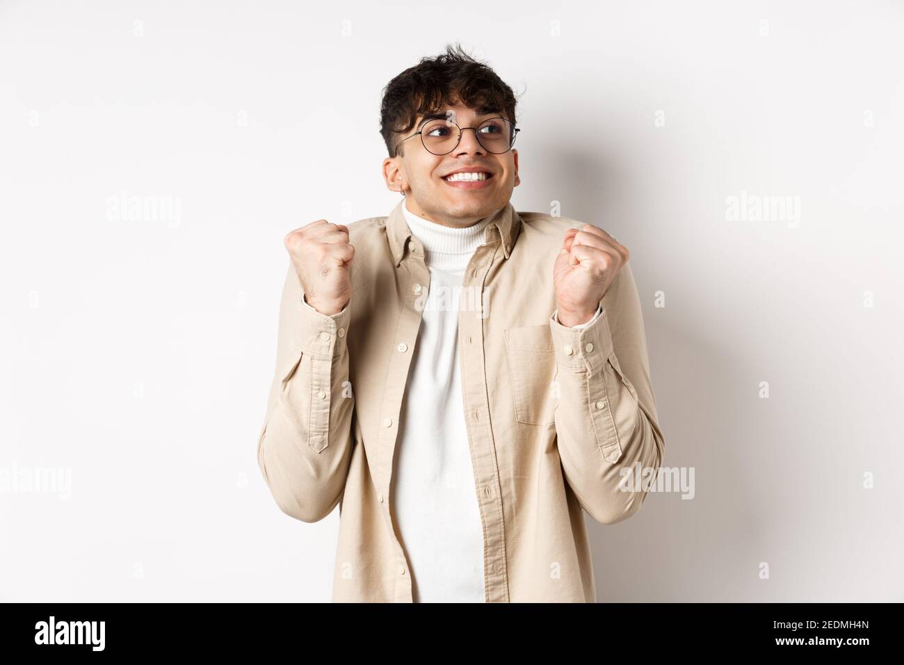 Image of handsome excited man feeling motivated and lucky, looking ...