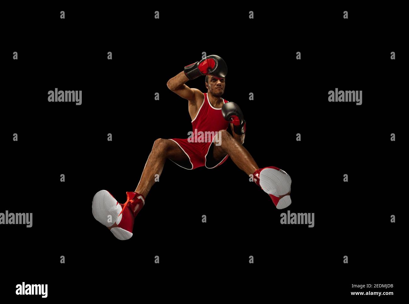 Young african-american professional boxer in action, motion isolated on ...