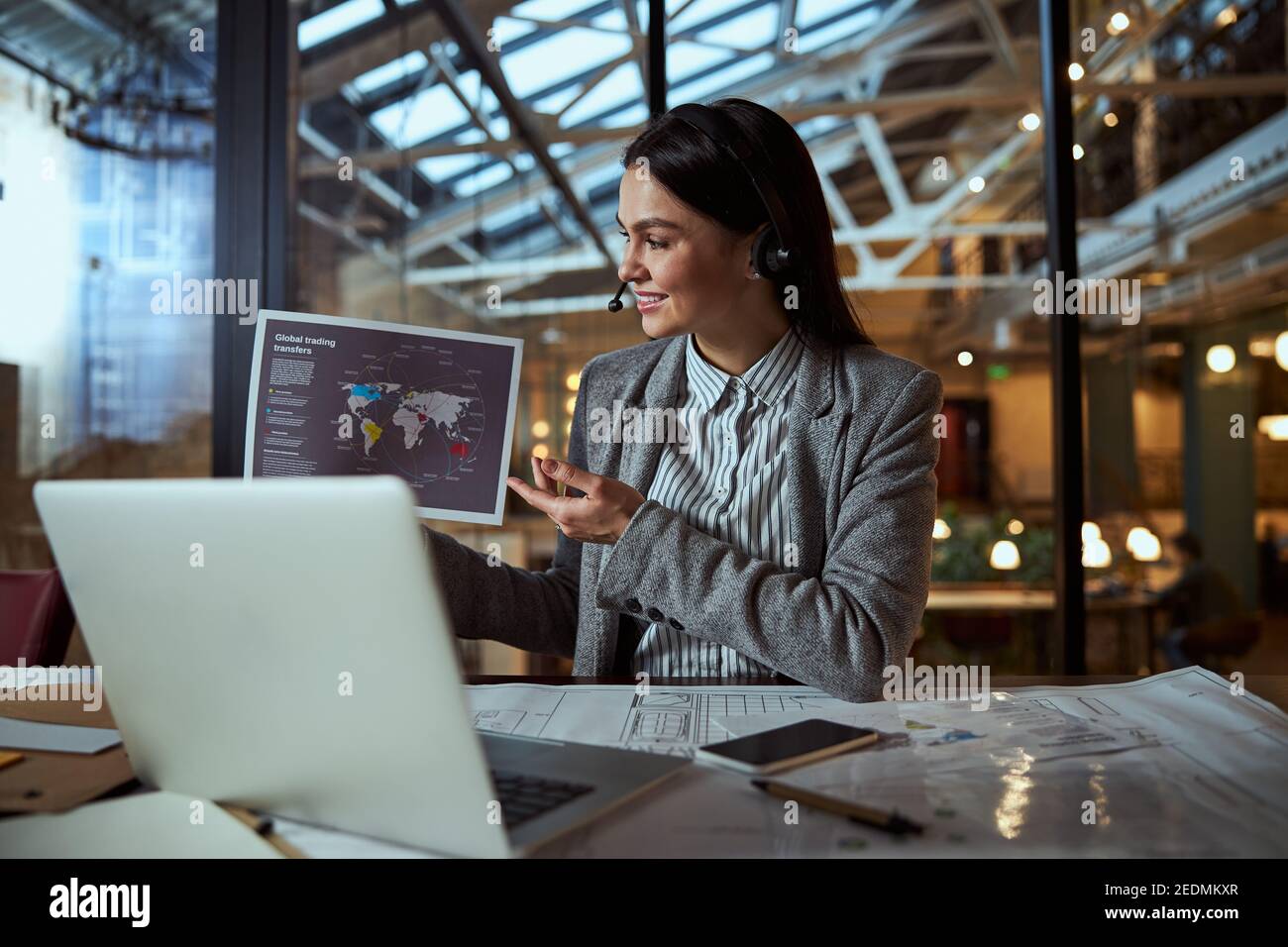 Cute female person looking at picture with countries Stock Photo - Alamy