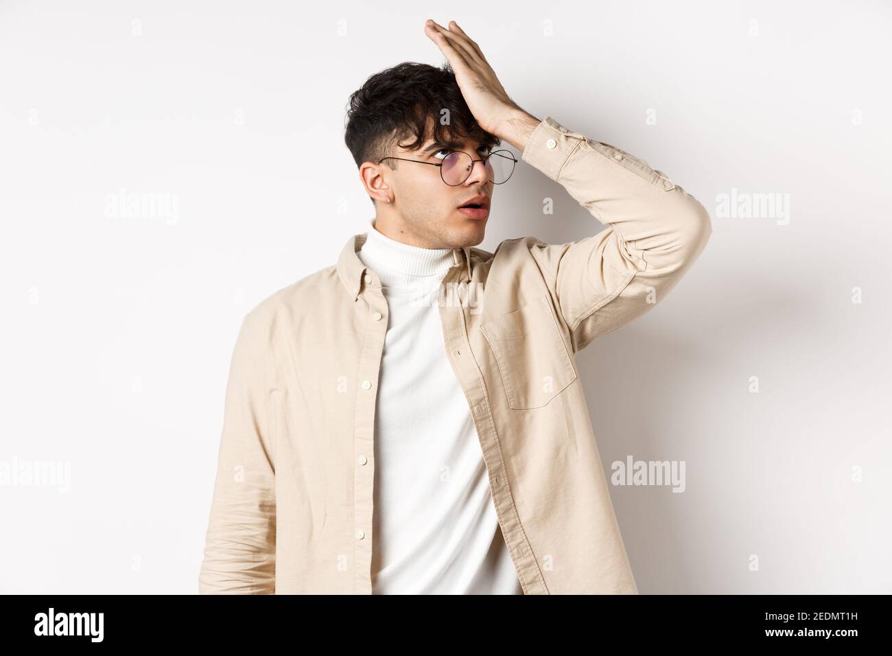 Portrait of annoyed stylish guy facepalm, roll eyes from something ...