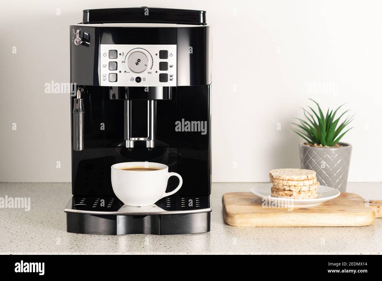 Modern espresso coffee machine with a cup in interior of kitchen ...