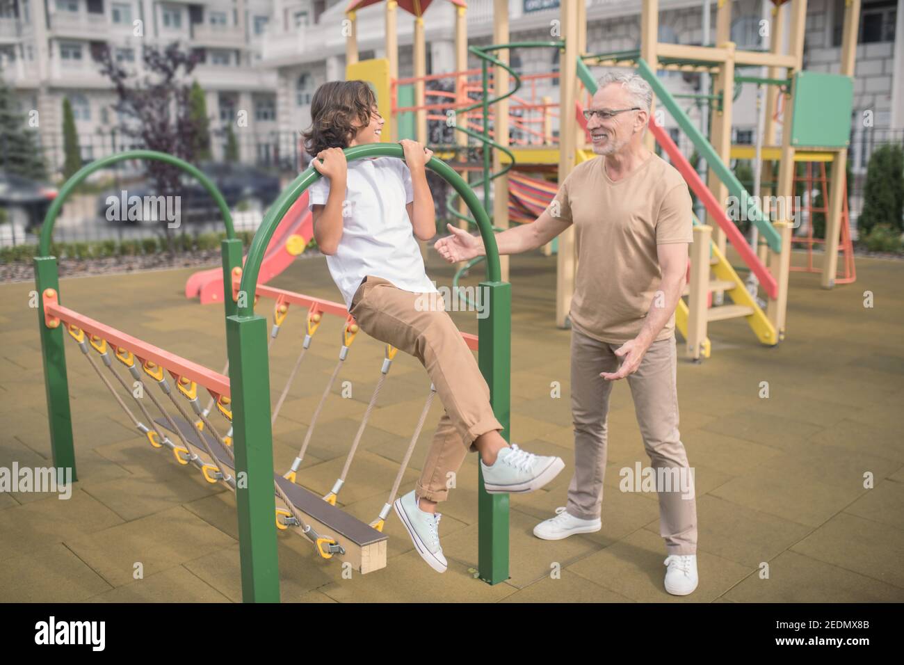 Father and son at the playground together Stock Photo - Alamy