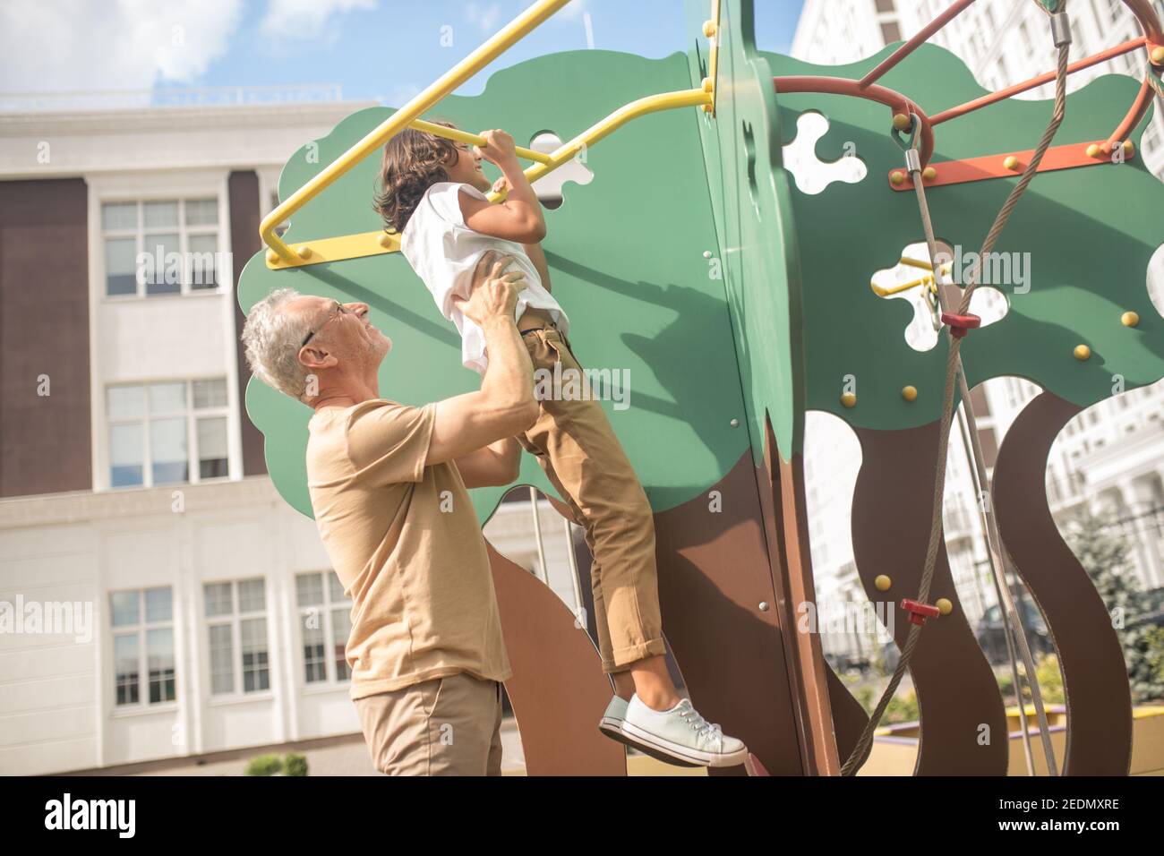Father and son at the playground together Stock Photo - Alamy