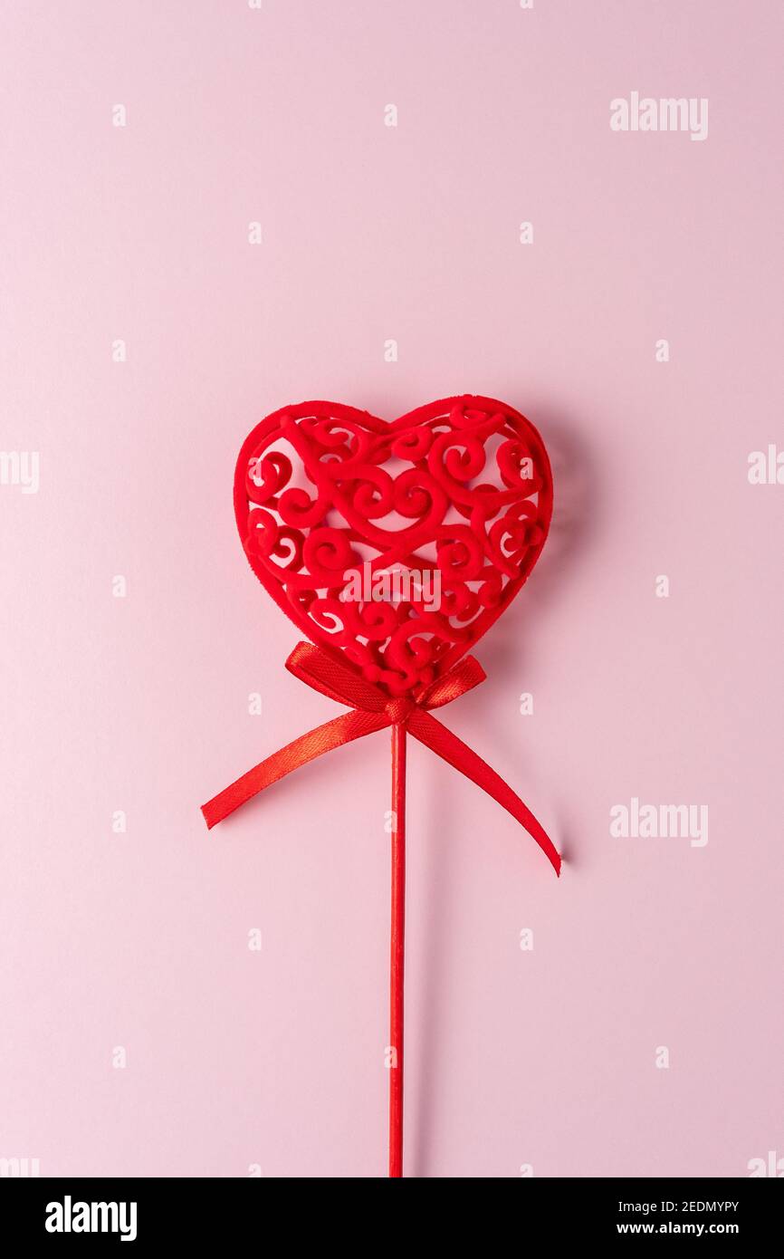 Red heart decor on pink background. Minimal love concept Stock Photo ...