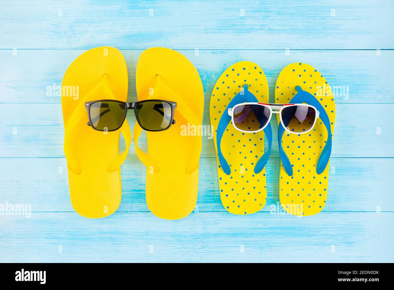Colorful yellow flip flops with sunglasses for summer beach holidays ...