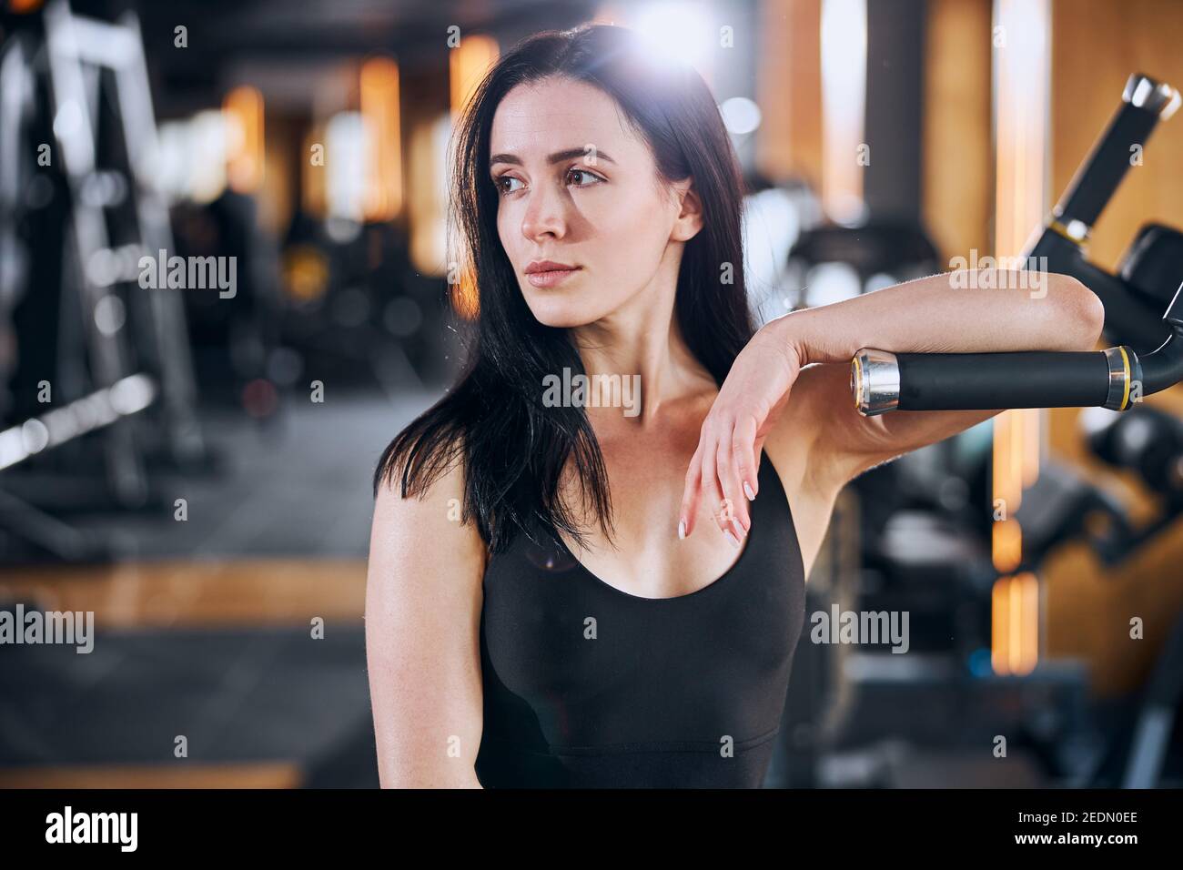 Pretty young fitness trainer standing in gym Stock Photo - Alamy