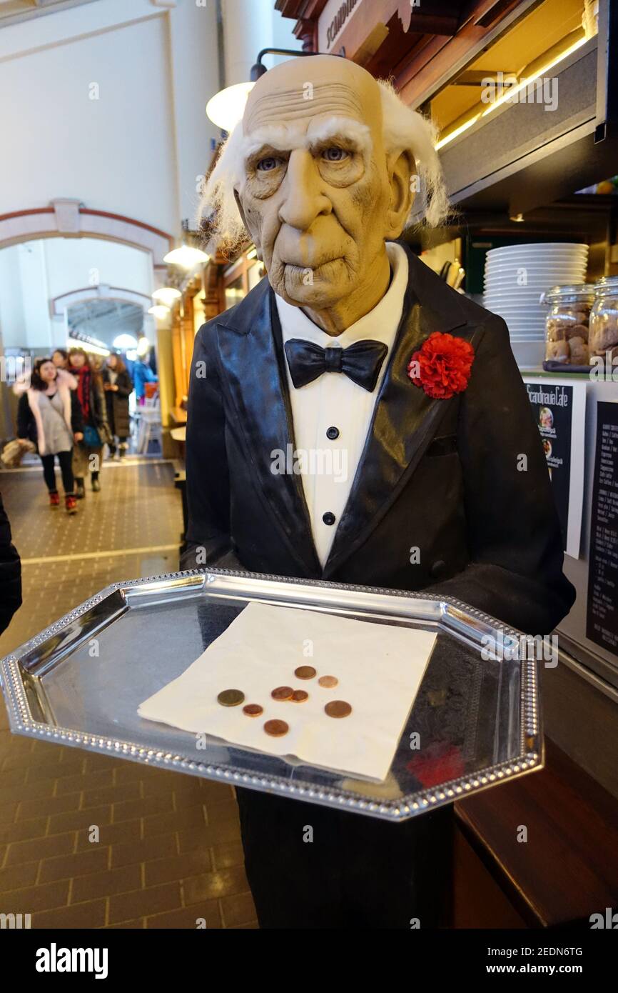 01.03.2018, Helsinki, , Finland - Waiter figure collecting tips ...