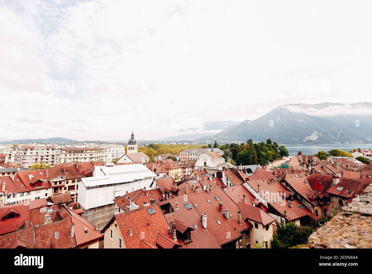Annecy city top view, lake in the distance. Tile roofs, Cathedral. High ...