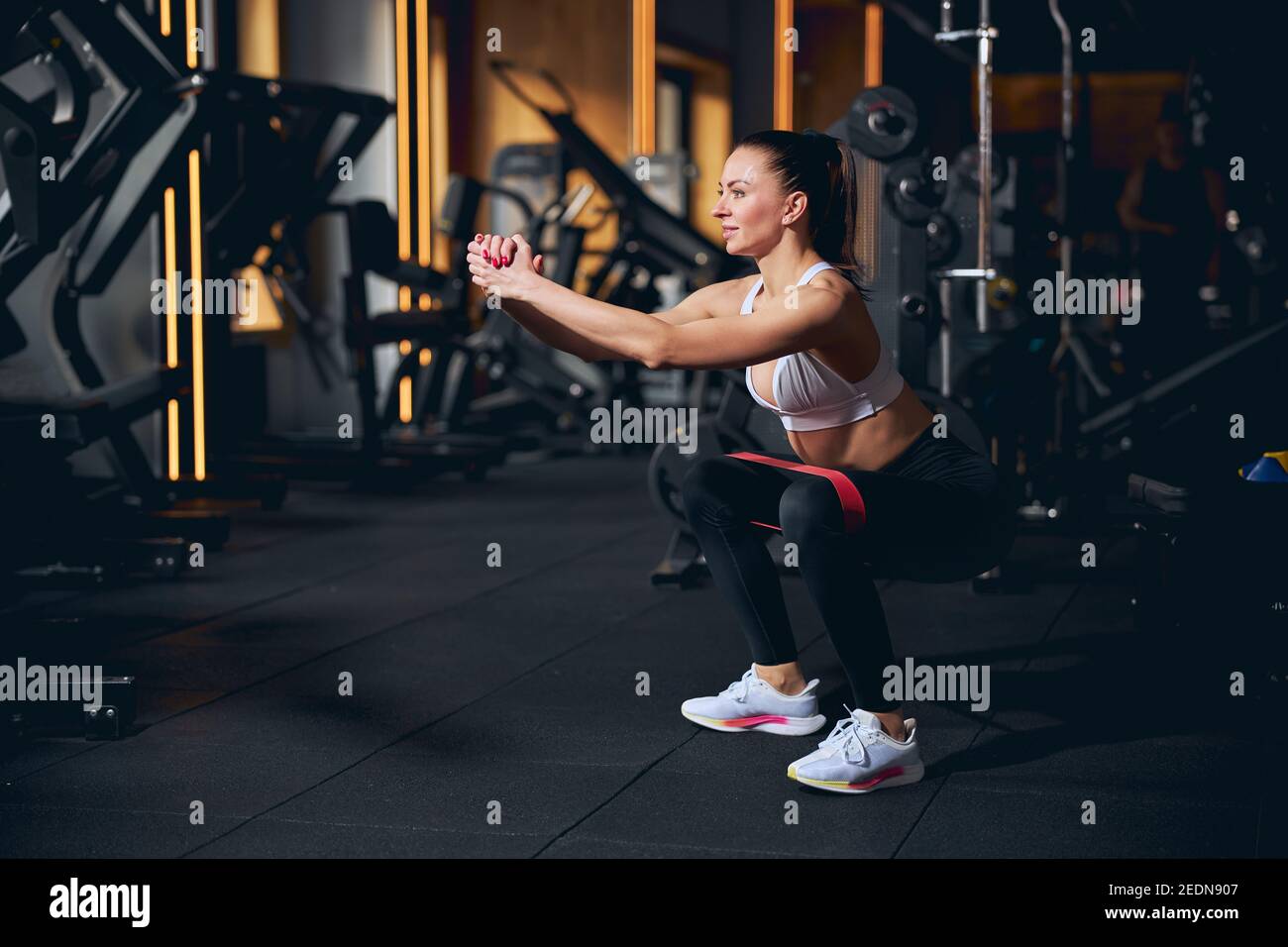 Young female doing squats gym hi-res stock photography and images - Alamy