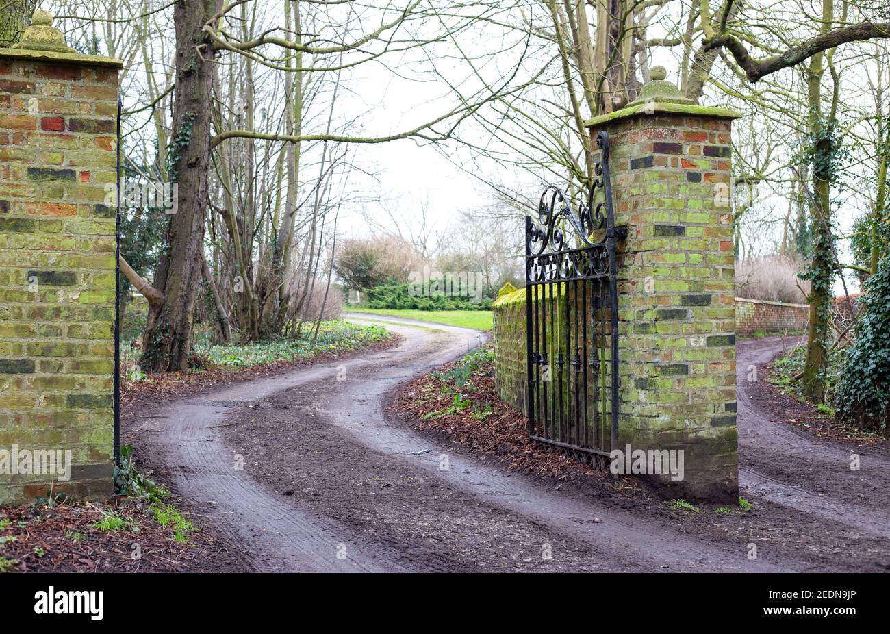 Old open Gate of Country Estate with iron antique gate. Road leading to ...