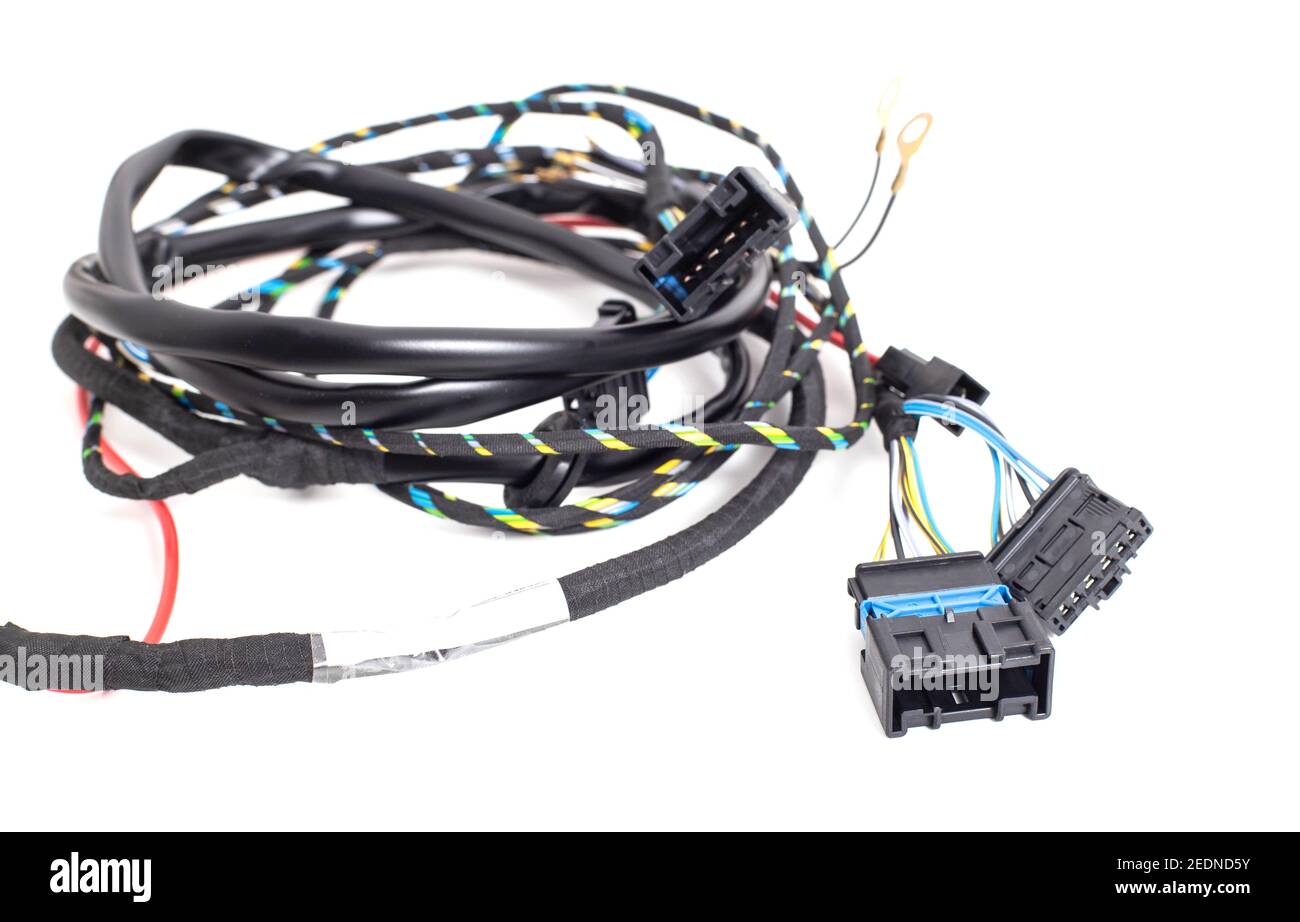 Braided automotive wiring with electrical connectors on white ...