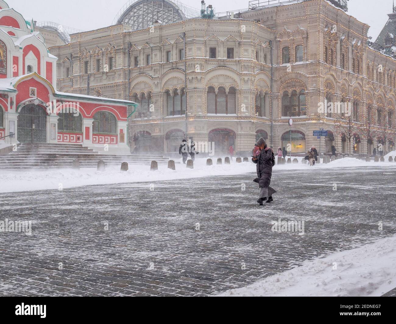 Moscow. Russia. February 12, 2021. Silhouette of a woman walking along ...