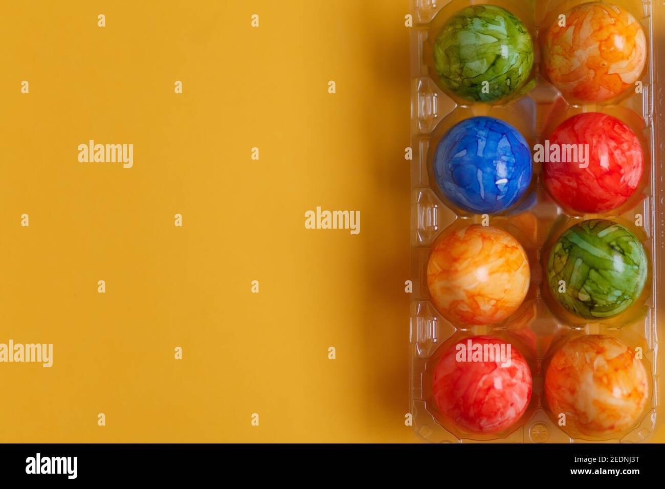 Easter card. Flat lay composition with easter eggs in plastic packaging ...