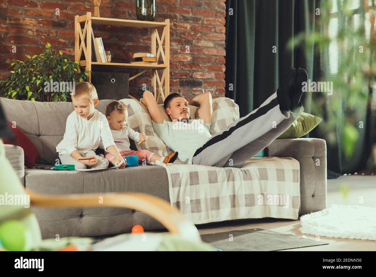 ABS workout. Young man exercising fitness, aerobic, yoga at home ...