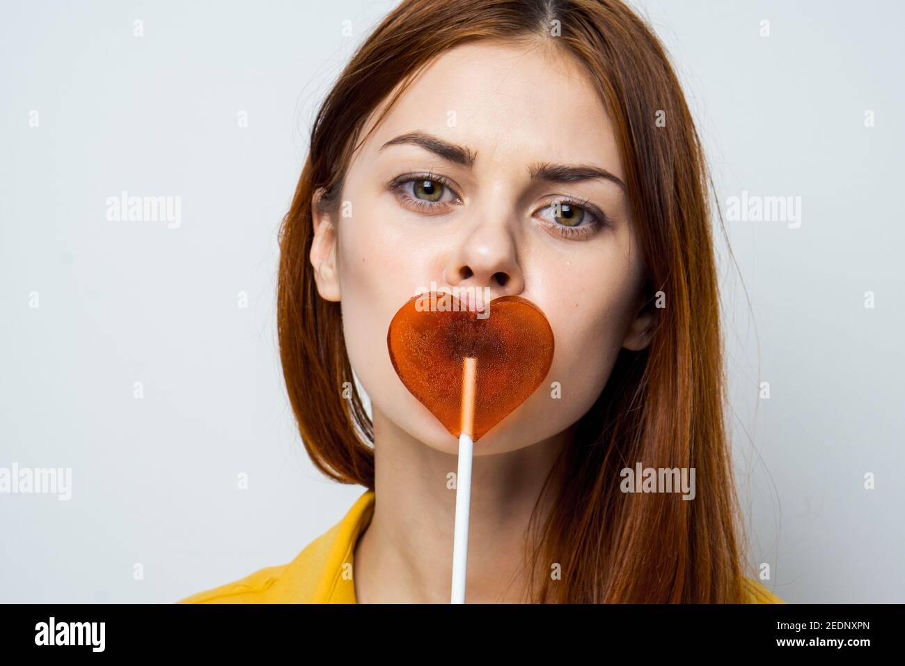 Pretty woman licking heart hi-res stock photography and images - Alamy