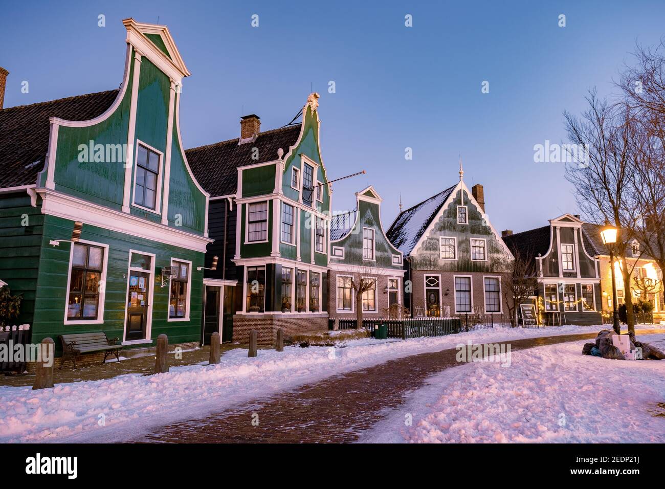 snow covered windmill village in the Zaanse Schans Netherlands ...
