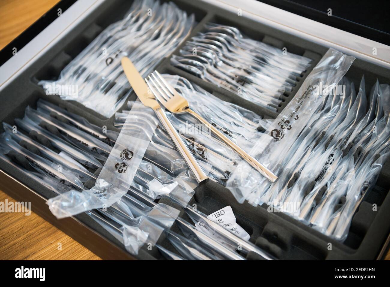 New cutlery sets flatware with fork and knife being unboxed from the ...