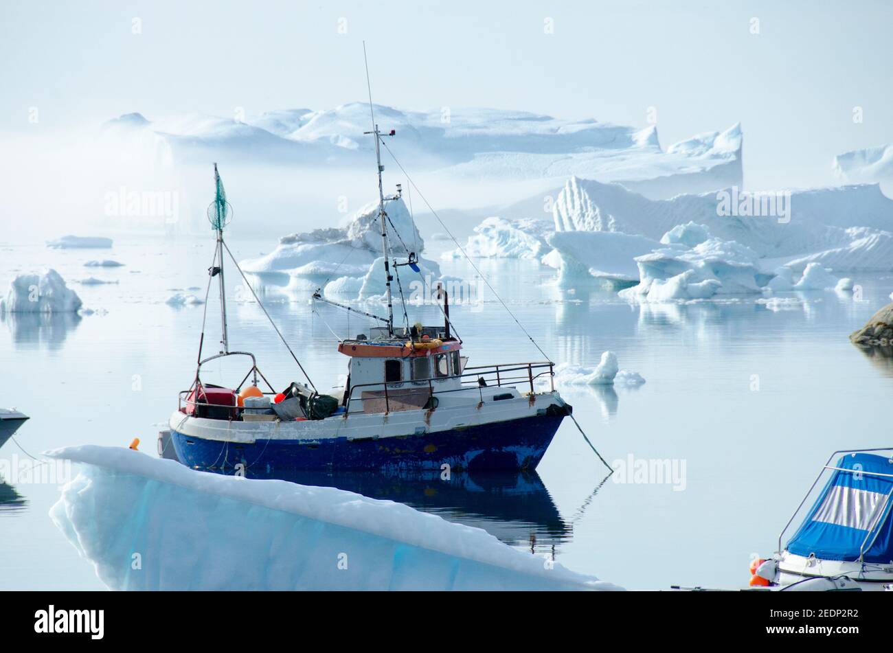 Small ship in Arctic harbour Stock Photo - Alamy
