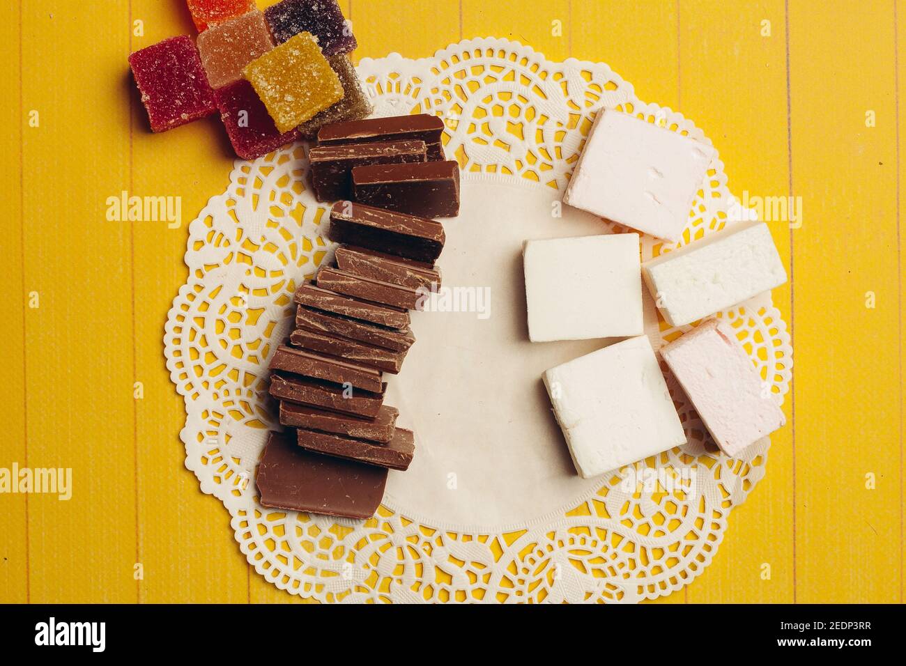 sweets marmalade chocolate snack food diet yellow background Stock ...
