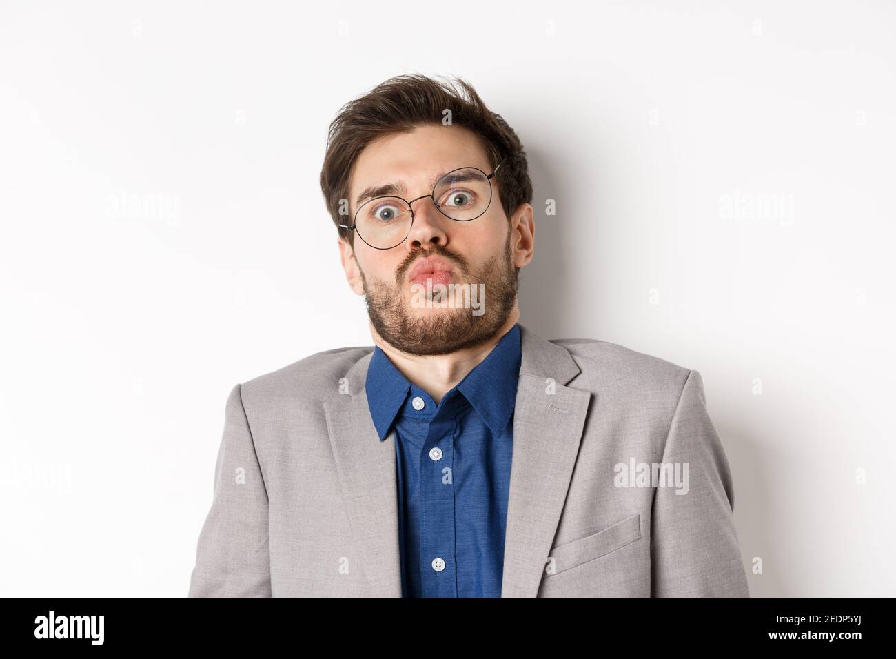 Startled guy in glasses and suit, tilt back and looking shocked or ...