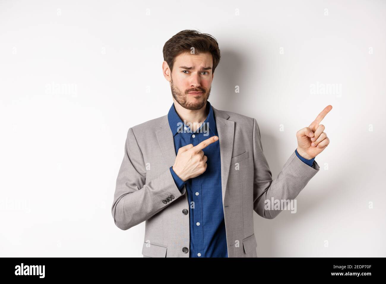 Showing bad example. Skeptical businessman look displeased and frowning ...