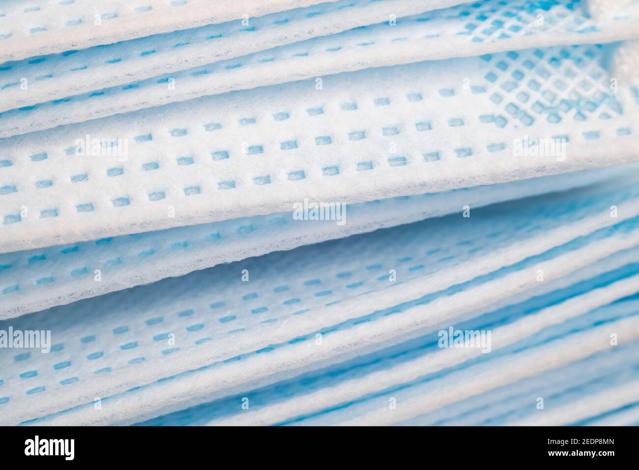 Textured surface of polyester fiber medical masks sideways close-up ...