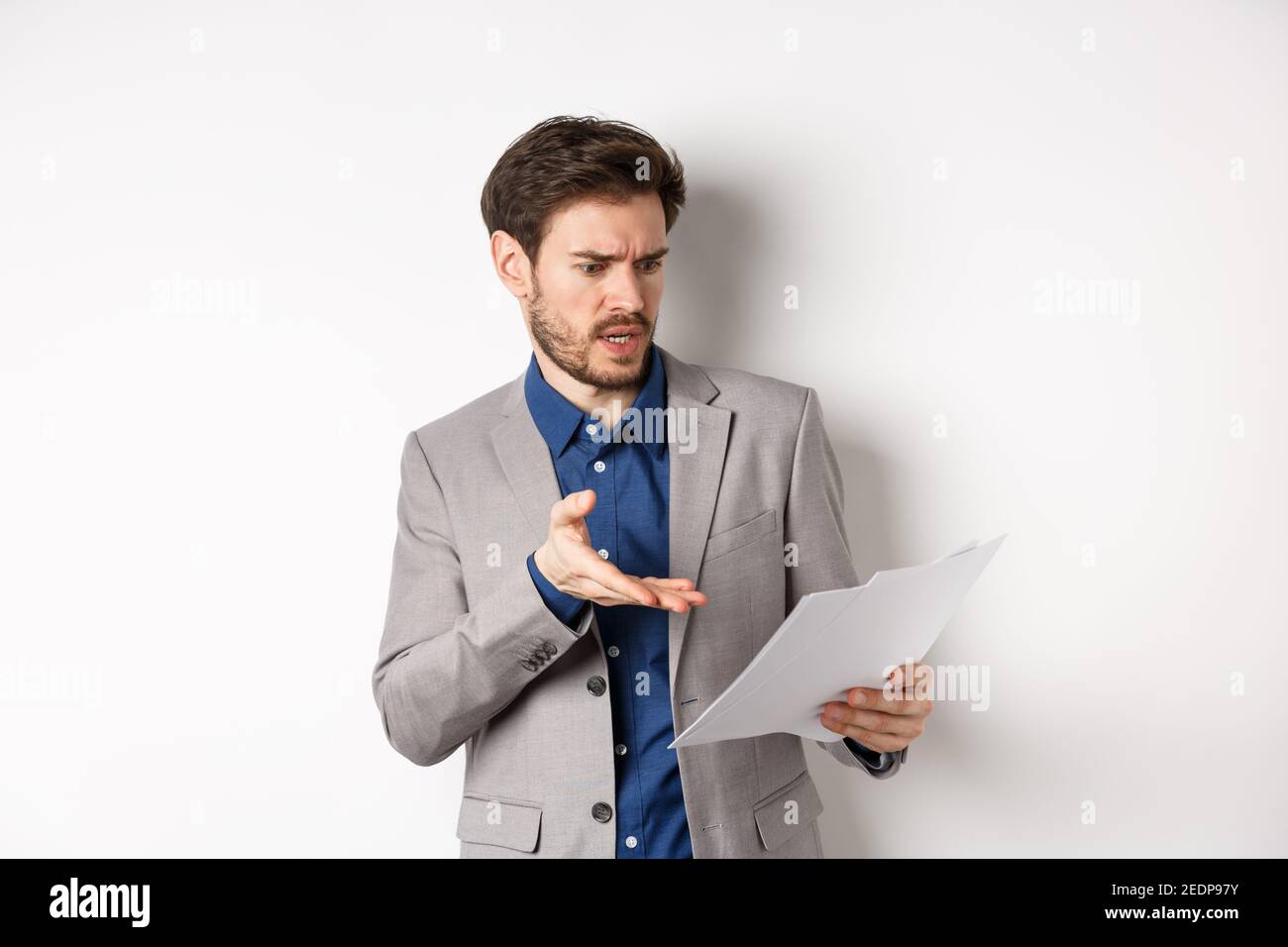 Angry employer looking at bad document, complaining on deal, pointing ...