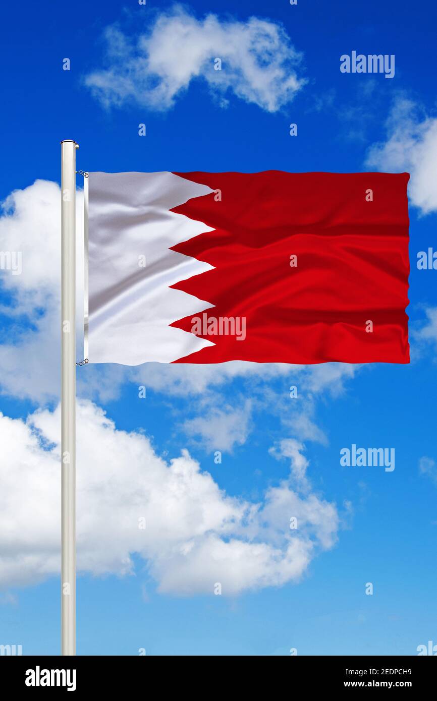 flag of Bahrain against blue cloudy sky, Bahrain Stock Photo - Alamy