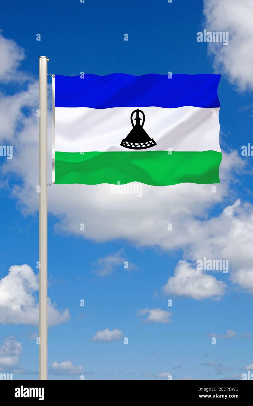 flag of Lesotho against blue cloudy sky, with Mokorotlo, Lesotho Stock ...