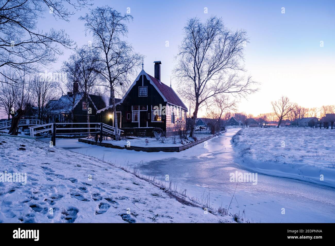 snow covered windmill village in the Zaanse Schans Netherlands ...