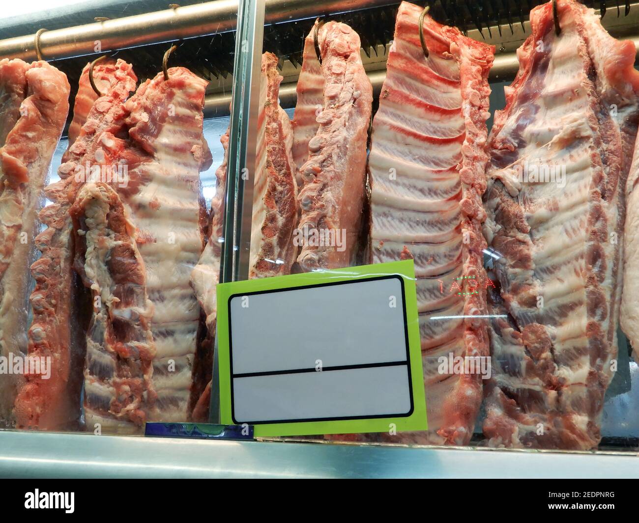 Fresh pork ribs in butchery showcase Stock Photo - Alamy