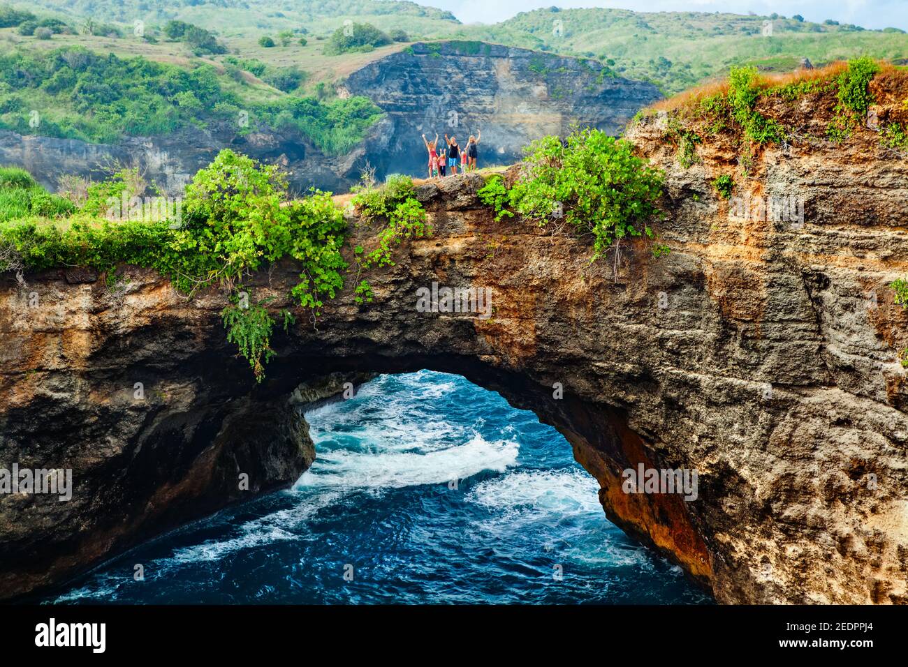 Family walk by natural bridge, look at natural sea pool Broken Bay ...