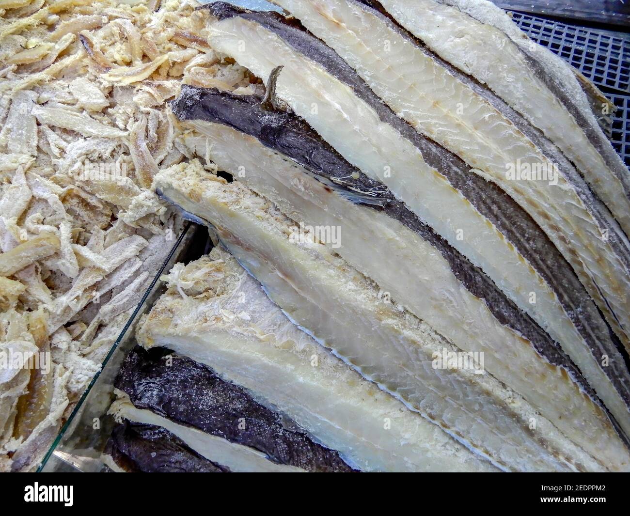 Salted saithe cod in the market Stock Photo - Alamy