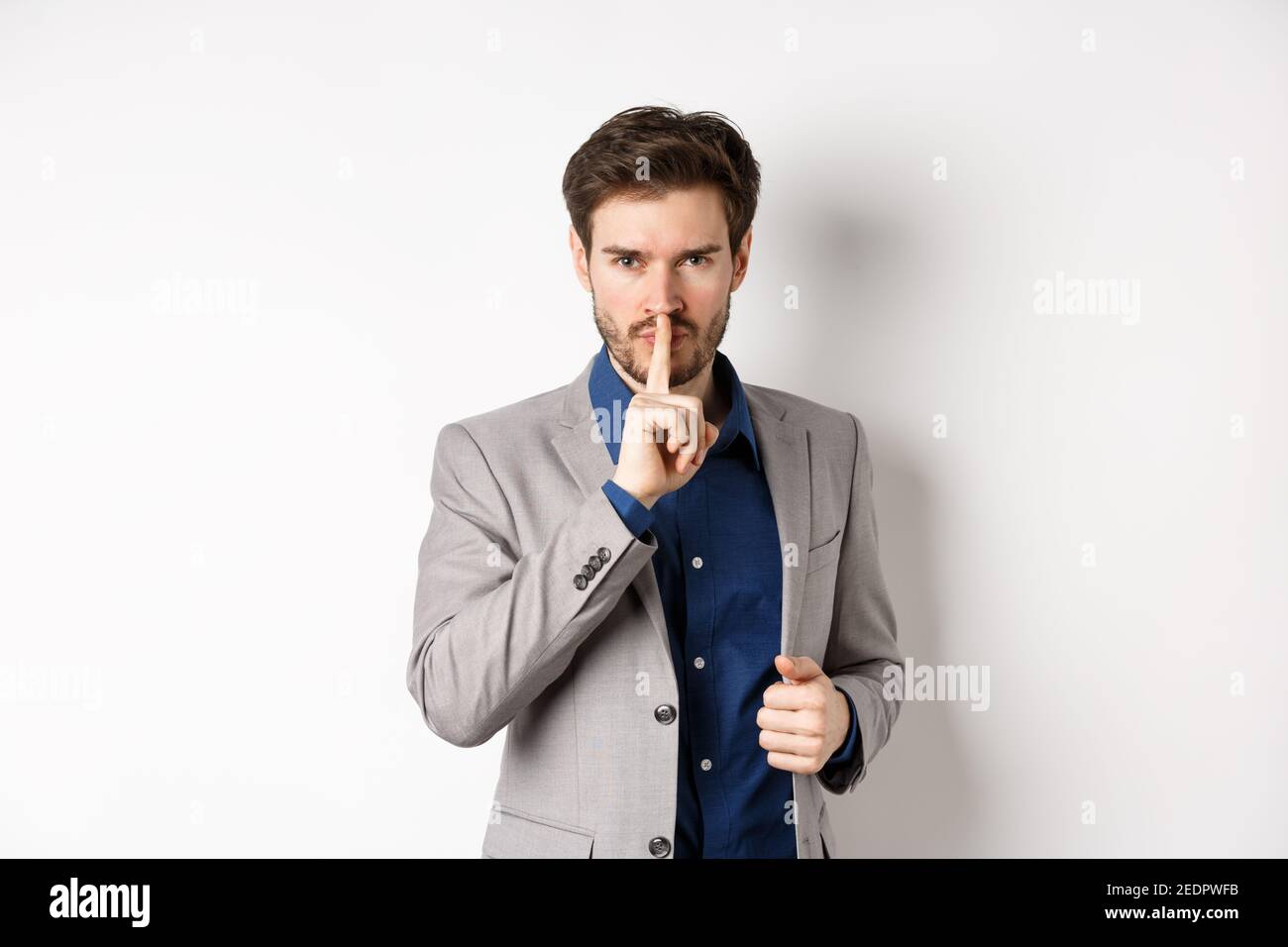 Angry man shushing camera hi-res stock photography and images - Alamy